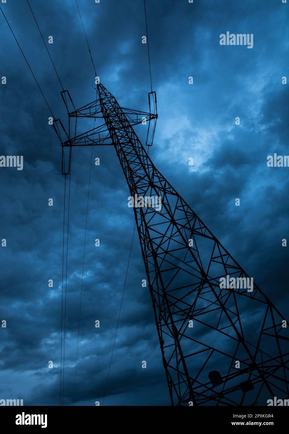 electrical tower and clouds at night Stock Photo - Alamy