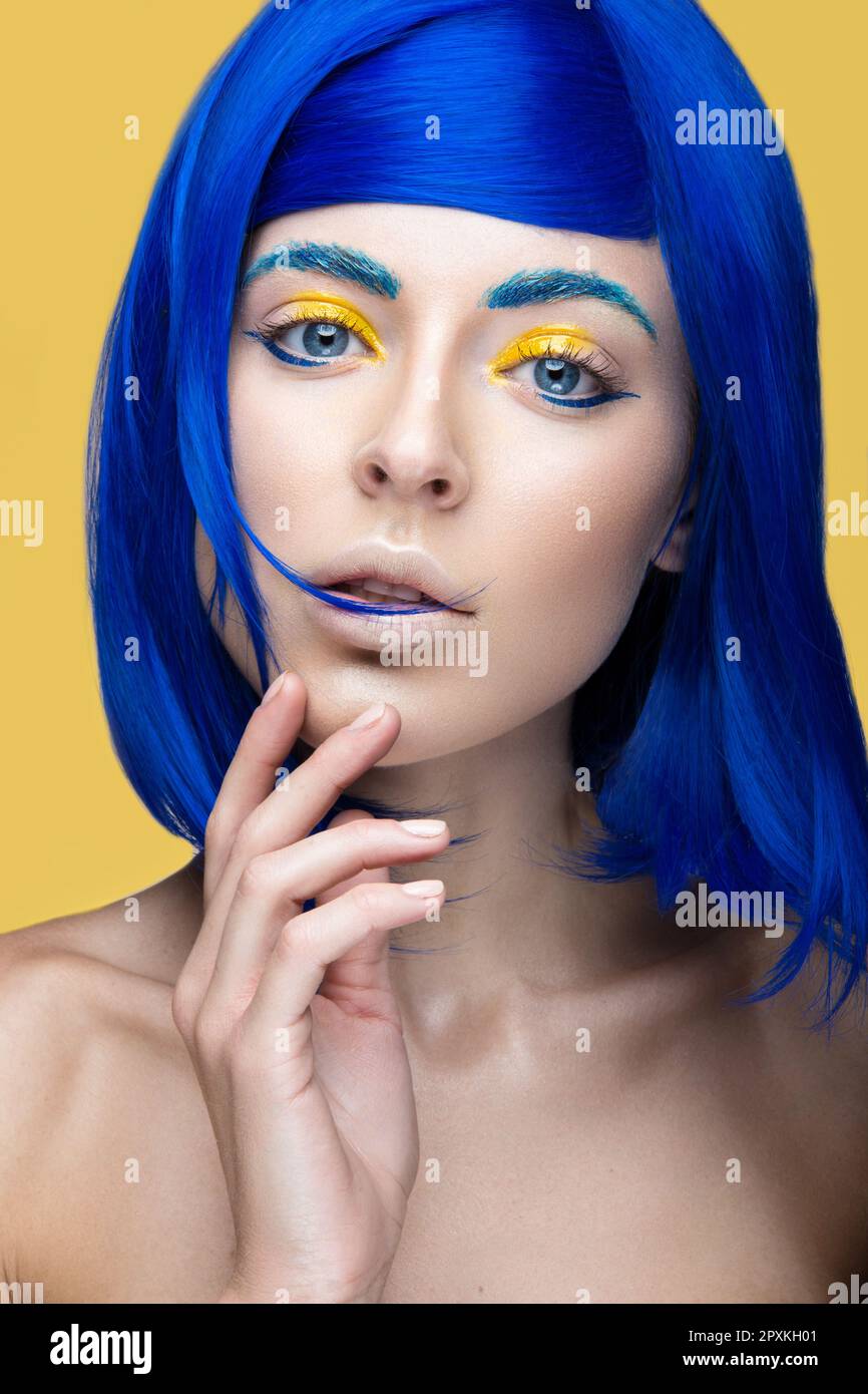 Beautiful girl in a bright blue wig in the style of cosplay and ...