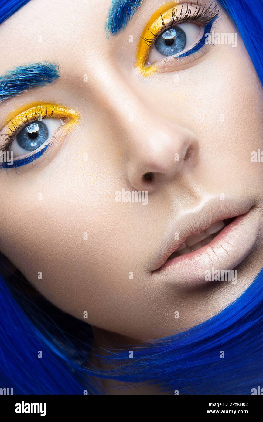 Beautiful girl in a bright blue wig in the style of cosplay and ...