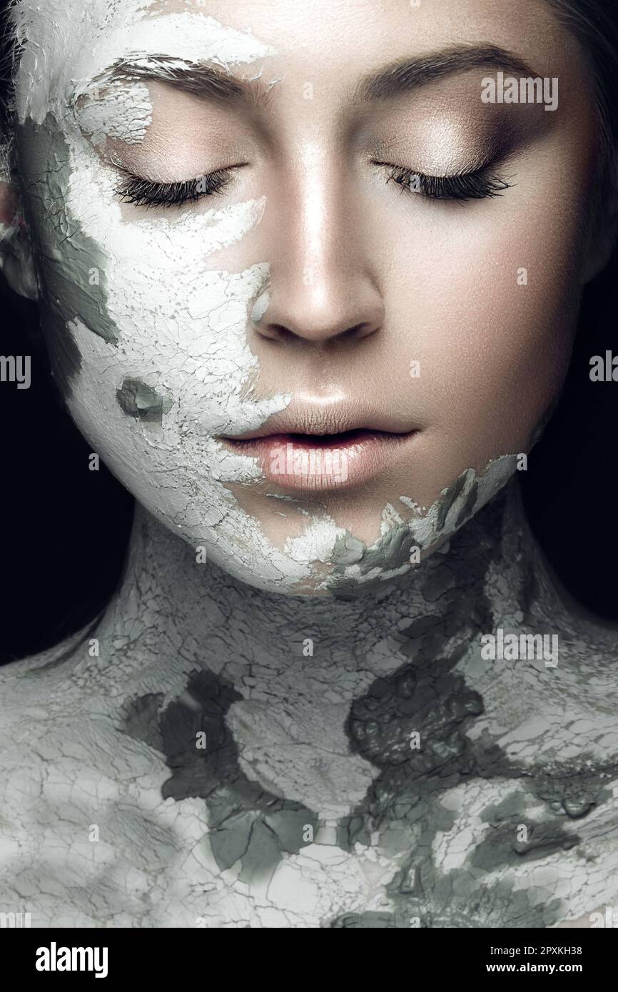 Beautiful girl with mud on his face. Cosmetic mask. Beauty face ...