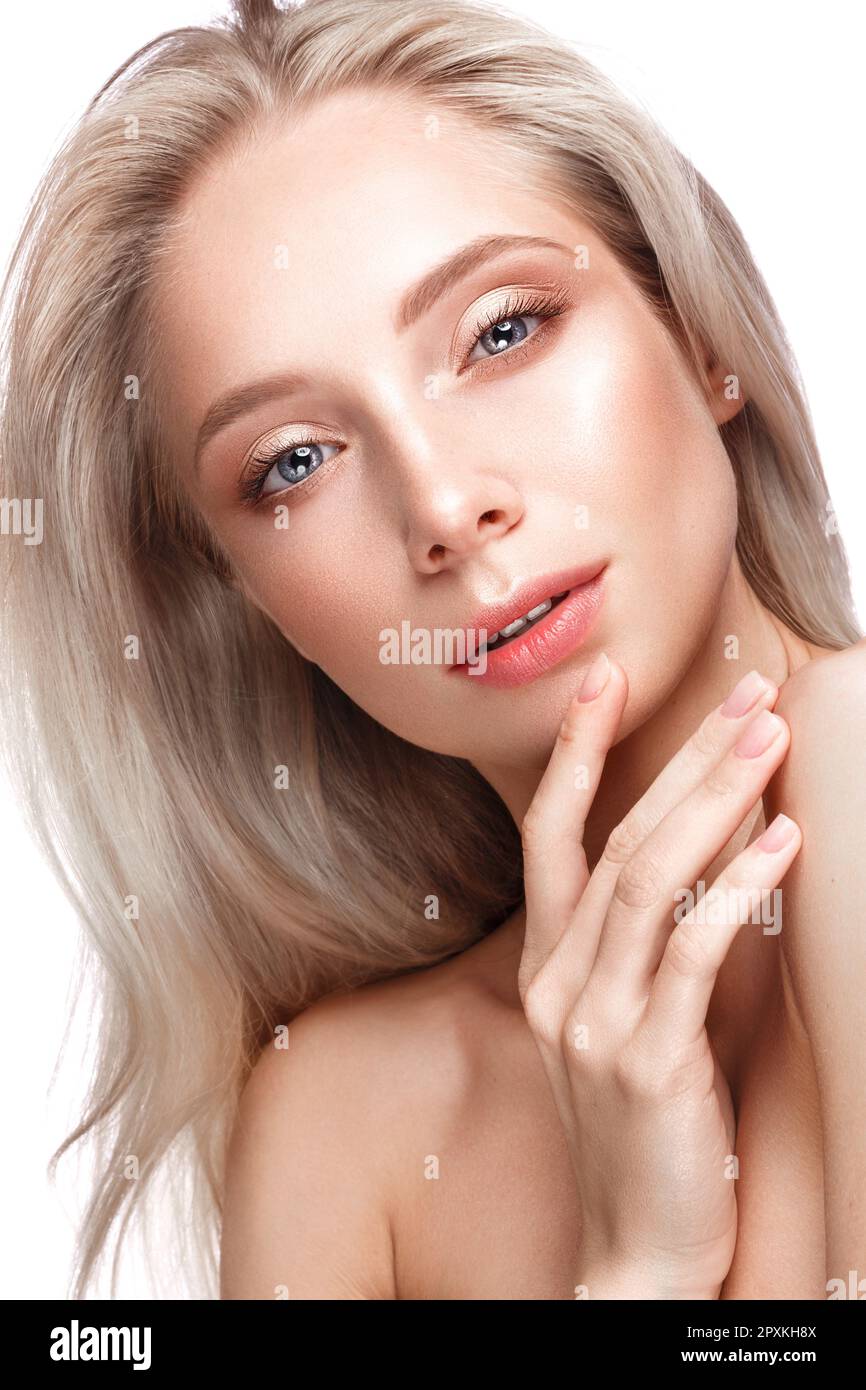 Beautiful young girl with a light natural make-up and perfect skin ...