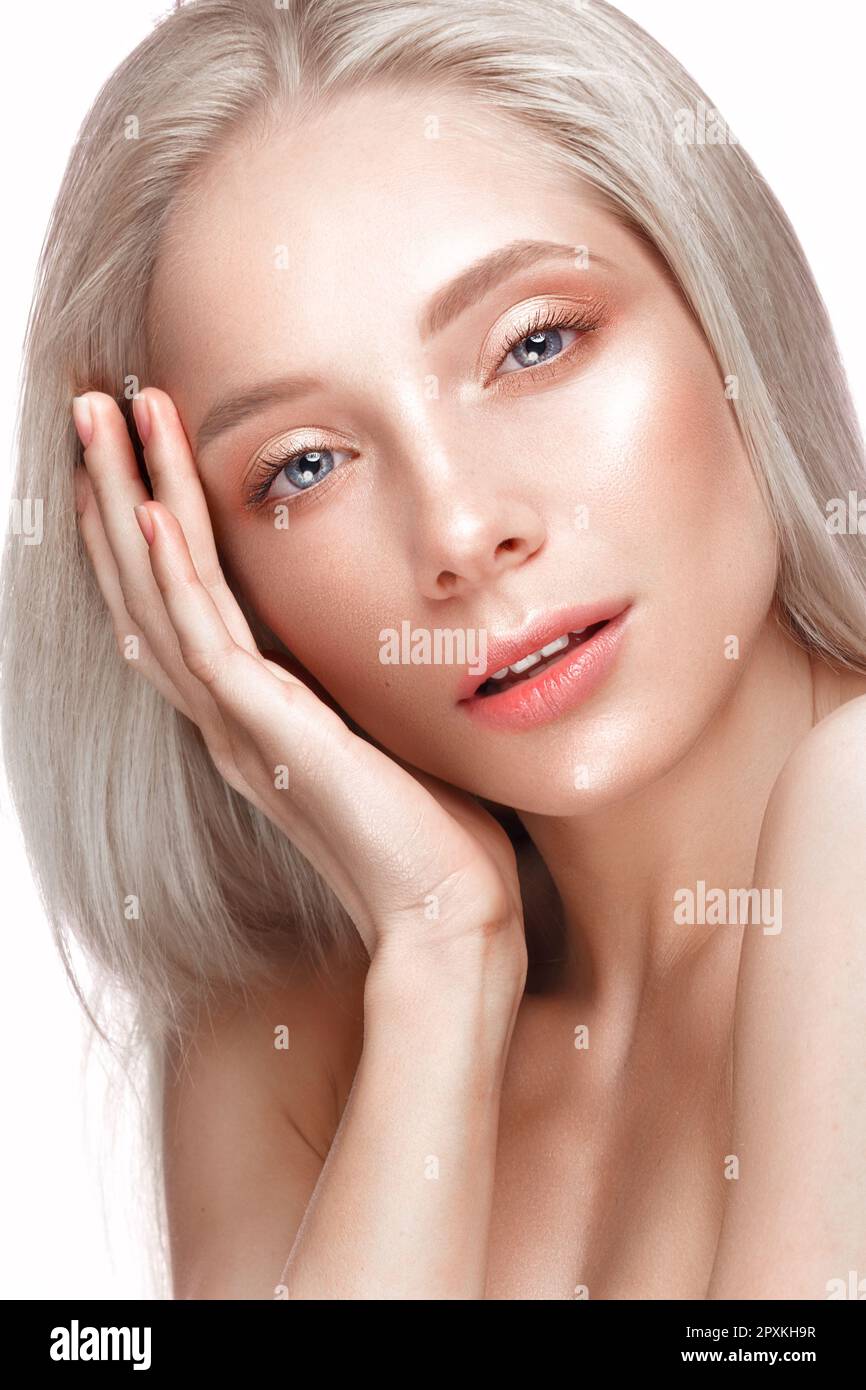 Beautiful young girl with a light natural make-up and perfect skin ...