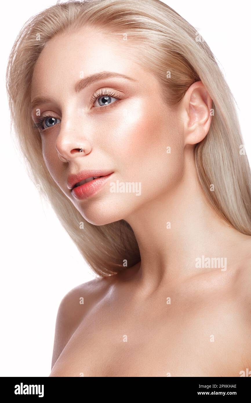 Beautiful young girl with a light natural make-up and perfect skin ...