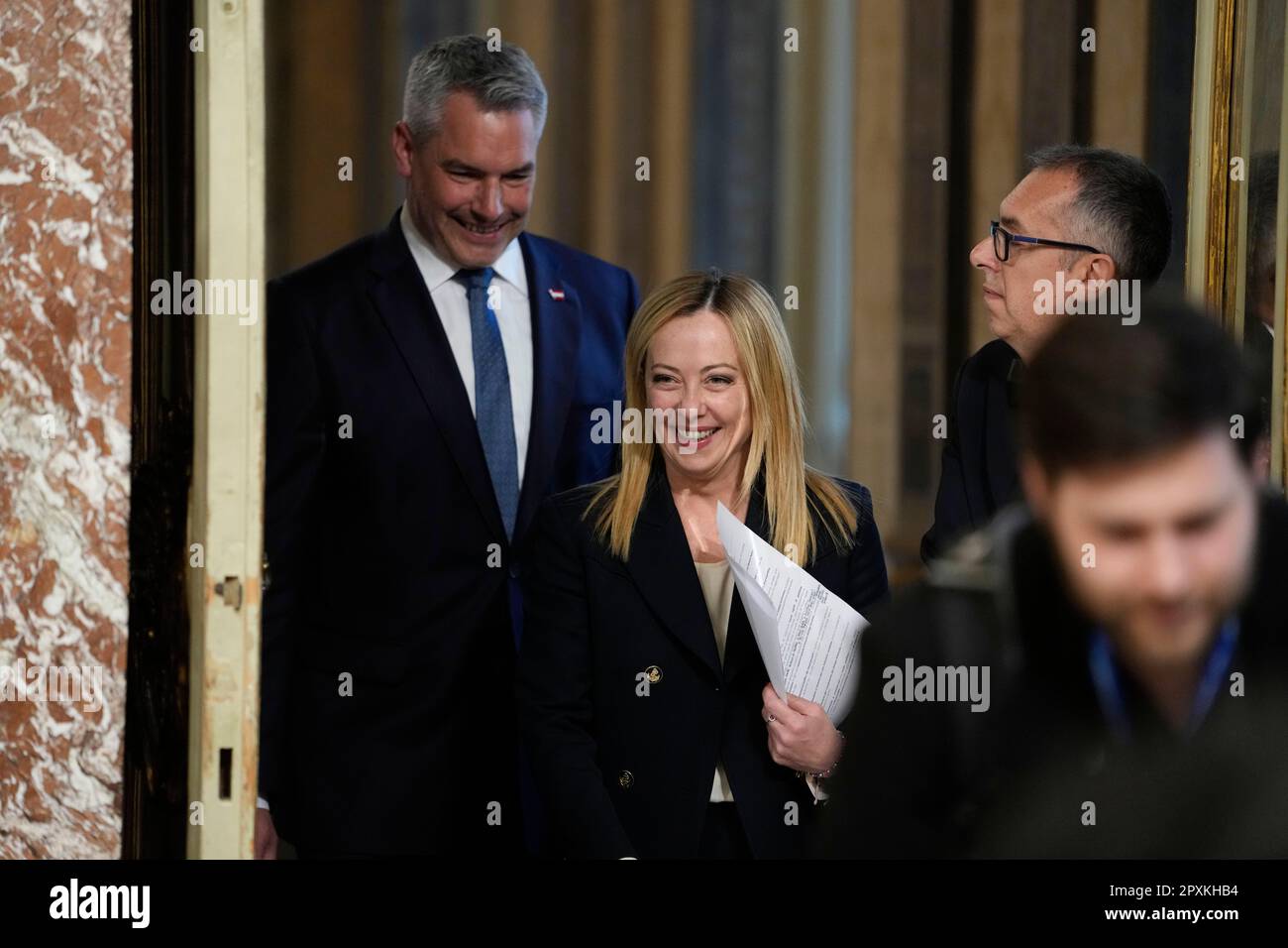 Italian Premier Giorgia Meloni, right, and Austria's Chancellor Karl Nehammer, left, arrive for ...