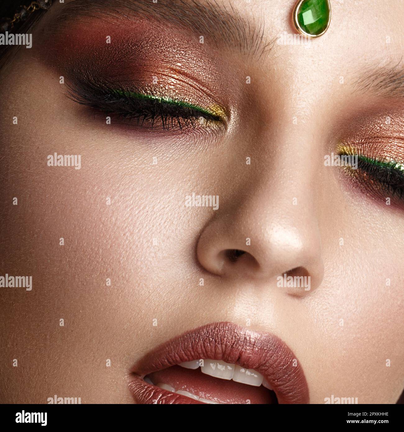 Beautiful girl with creative colorful makeup. Beauty face. Photos shot ...