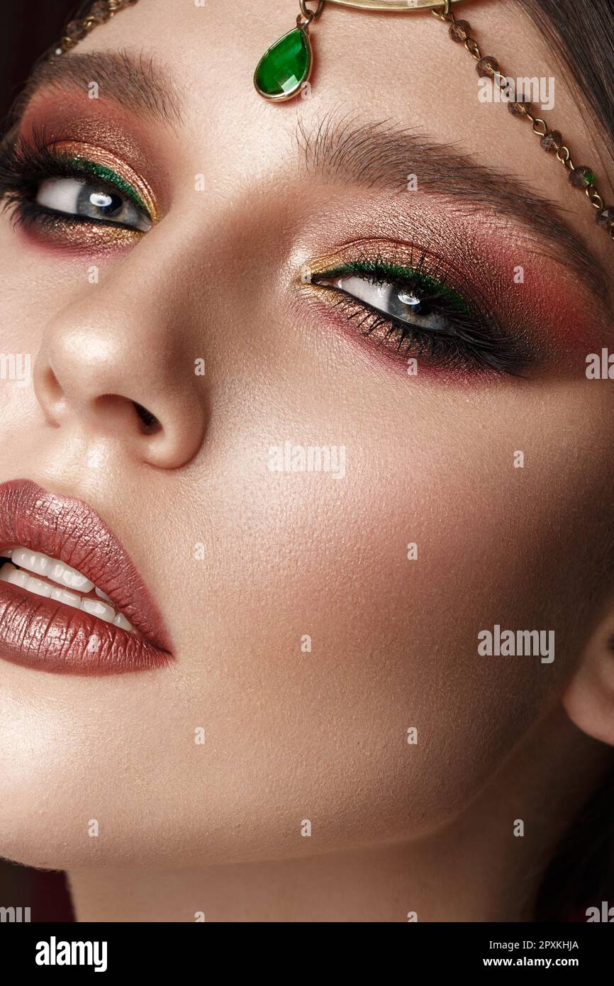 Beautiful girl with creative colorful makeup. Beauty face. Photos shot ...