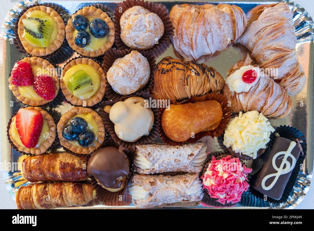Top view of assortment of delicious and colorful pastries, made by ...