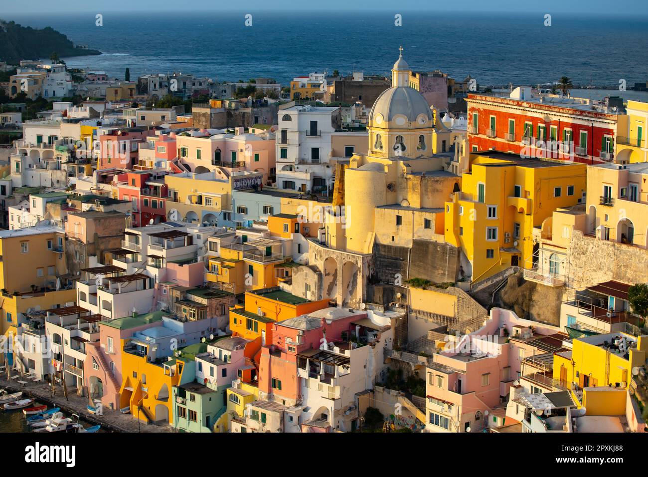 View of the Port of Corricella with lots of colorful houses in the ...