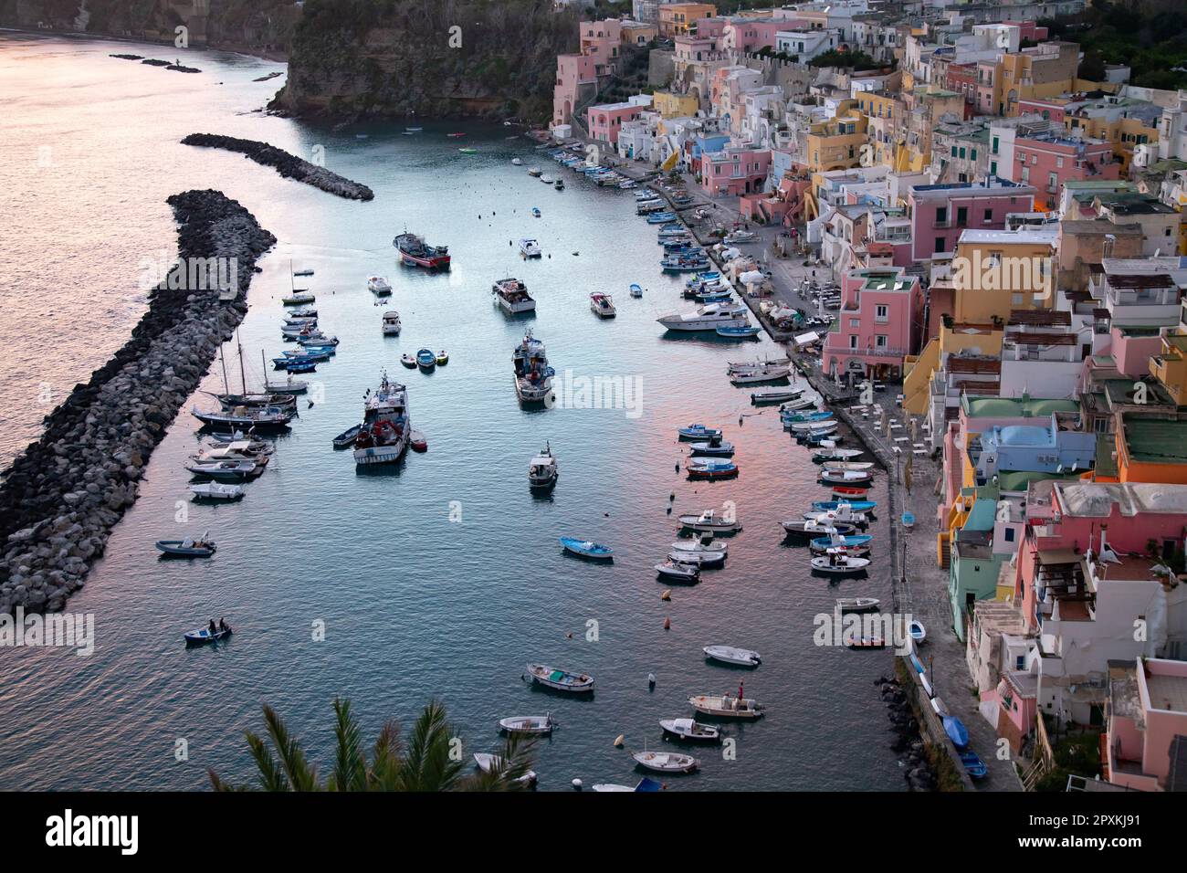 View of the Port of Corricella with lots of colorful houses in the ...
