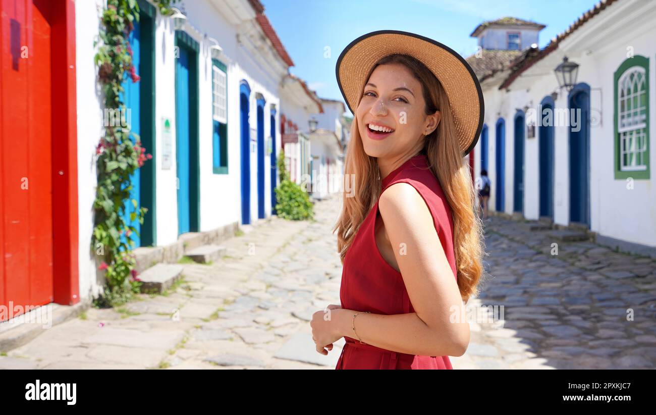 Portrait of attractive tourist woman in Paraty, Rio de Janeiro, Brazil ...