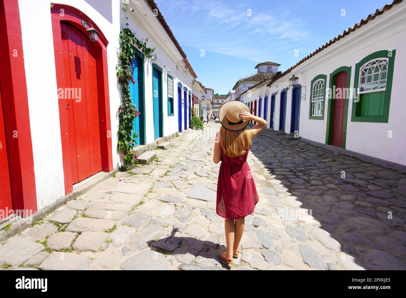 Holidays in Paraty, Brazil. Back view of beautiful fashion girl ...