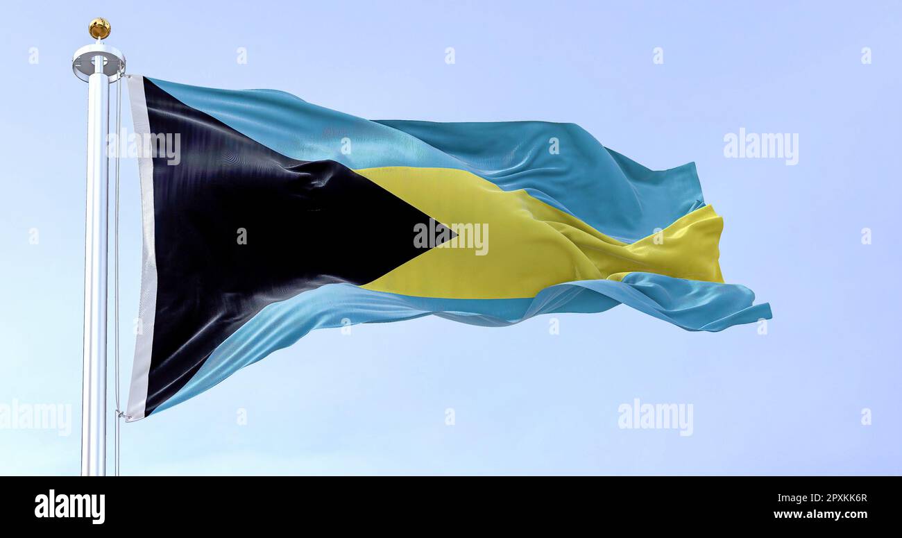 Close-up view of the Bahamas national flag waving in the wind. Black ...