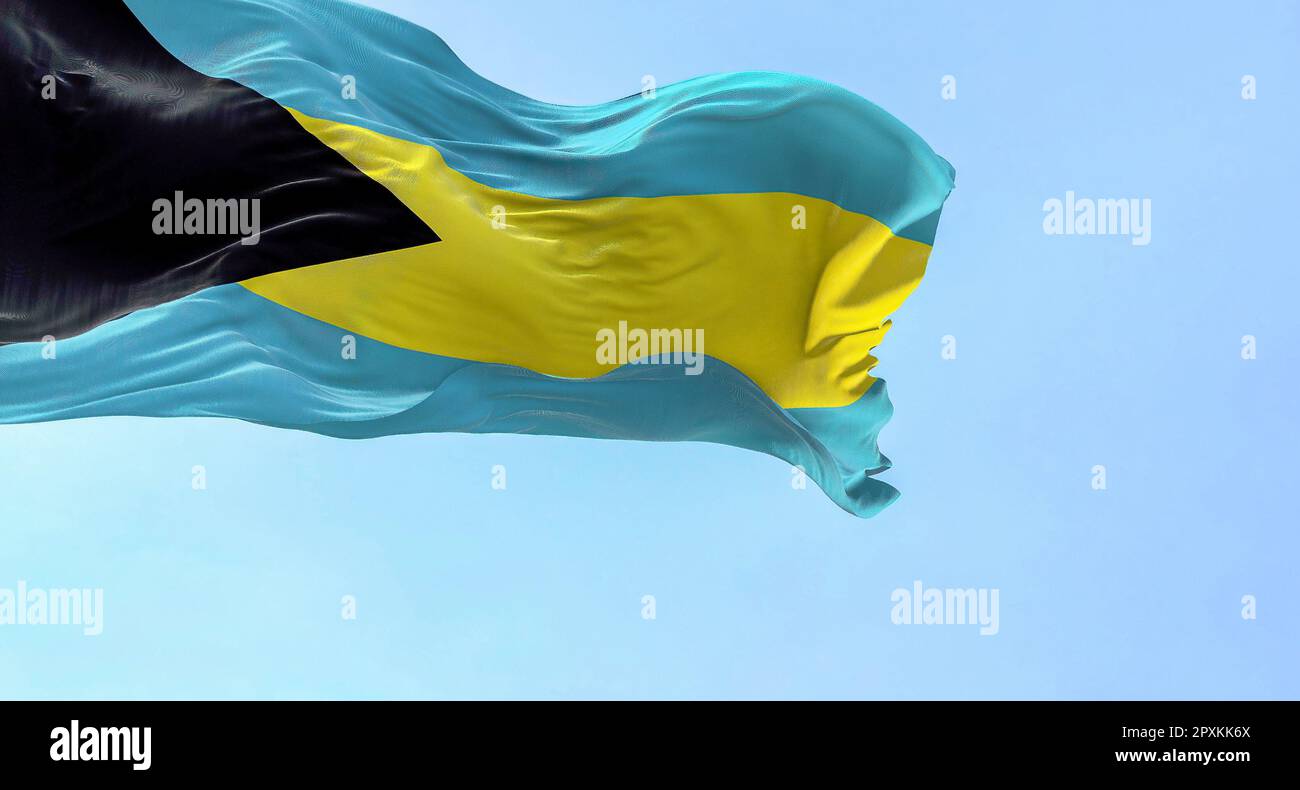 Close-up view of the Bahamas national flag waving in the wind. Black ...