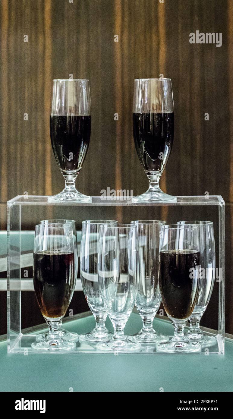 There is a pile of tall glasses on the wedding stage Stock Photo - Alamy