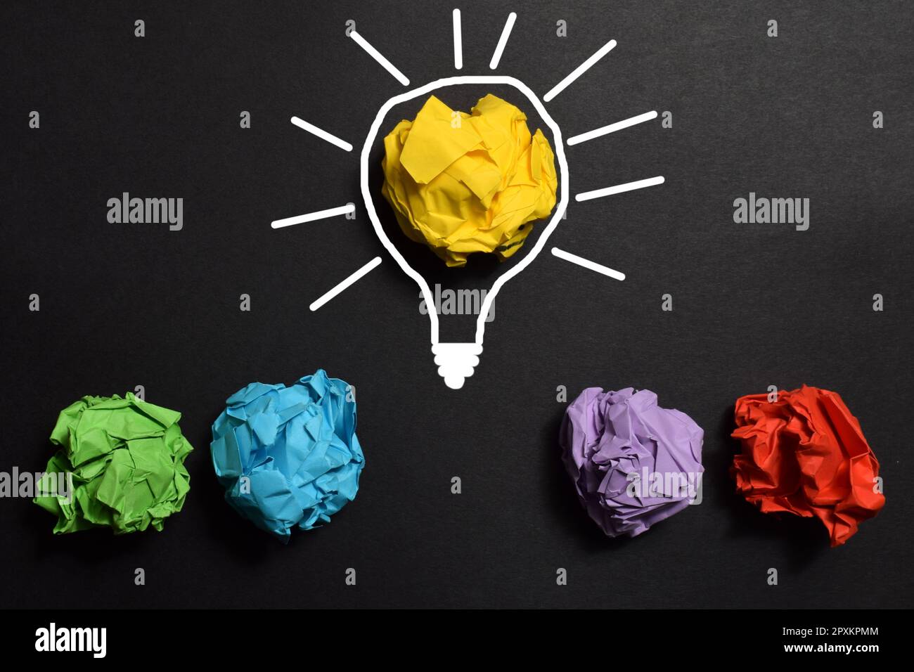 Colored crumpled paper balls and light bulb as creative concept Stock ...
