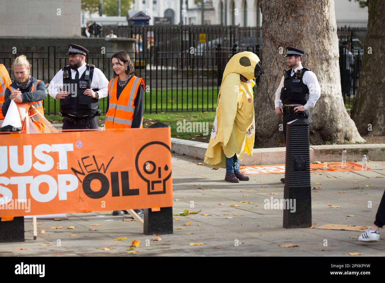 Police officers talk to Just Stop Oil activists in Westminster, central ...
