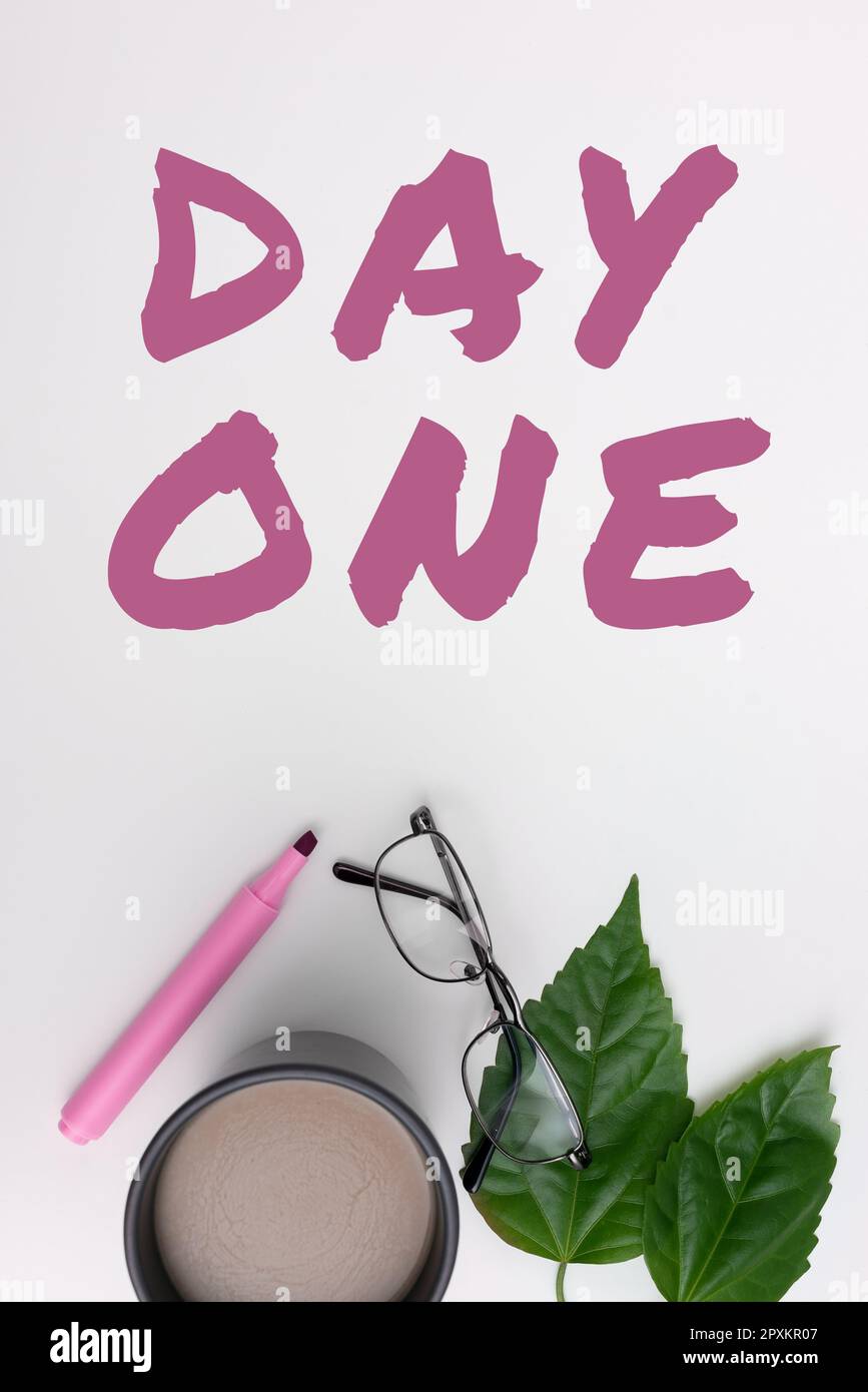 Hand writing sign Day One, Word Written on Start moment First step ...