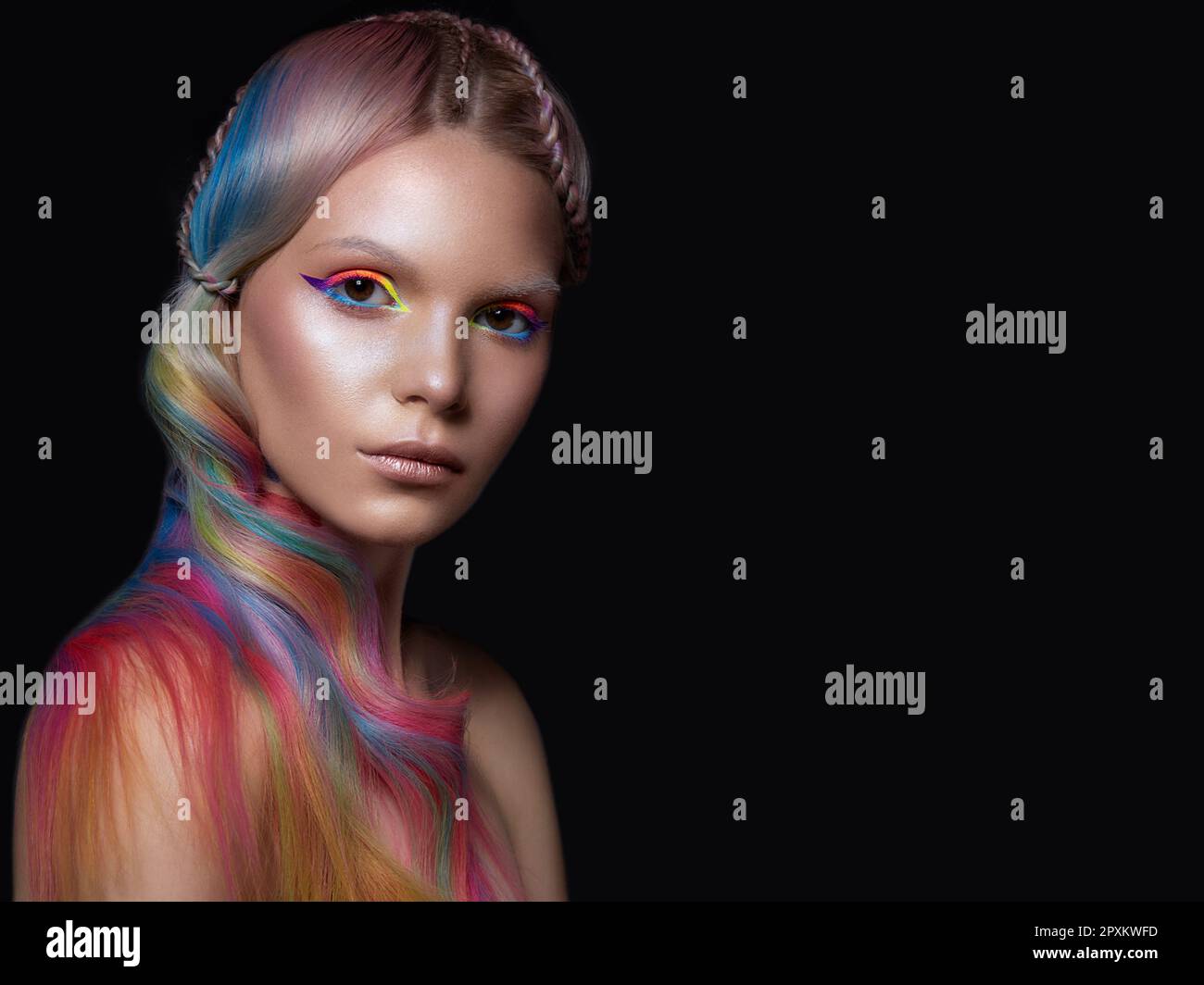 Beautiful girl with multi-colored hair and creative make-up and ...