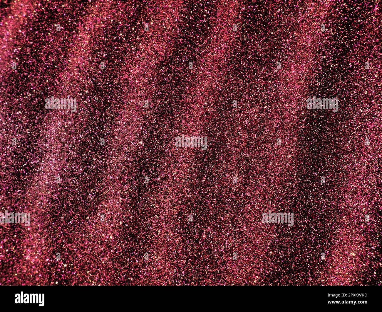 Bokeh light of pink glitters on black background. Magenta glitter ...