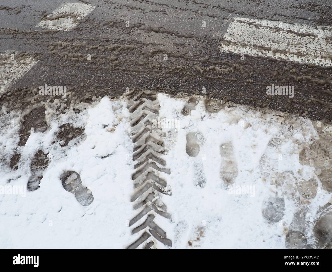 A fork or siding from a roundabout. Snowdrifts on the side of the road ...