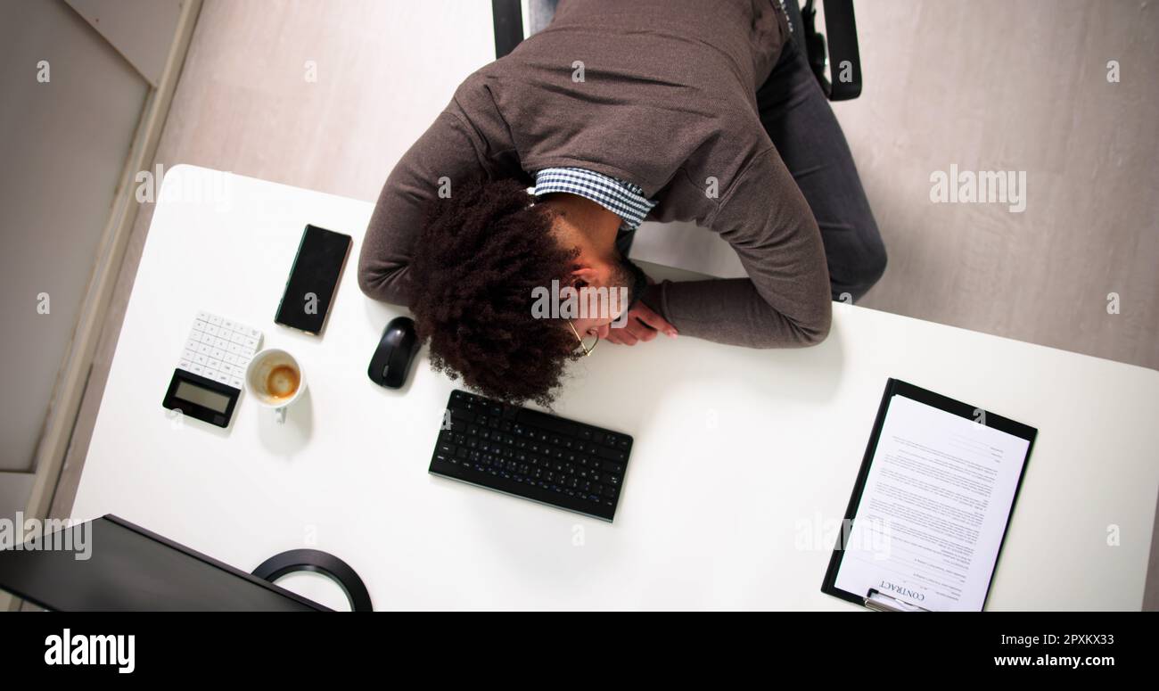 Black businessman sleeping desk hi-res stock photography and images - Alamy