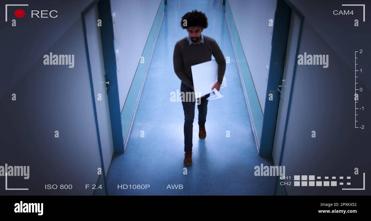 Young Man Stealing Computer Monitor Walking In Building Corridor Stock ...