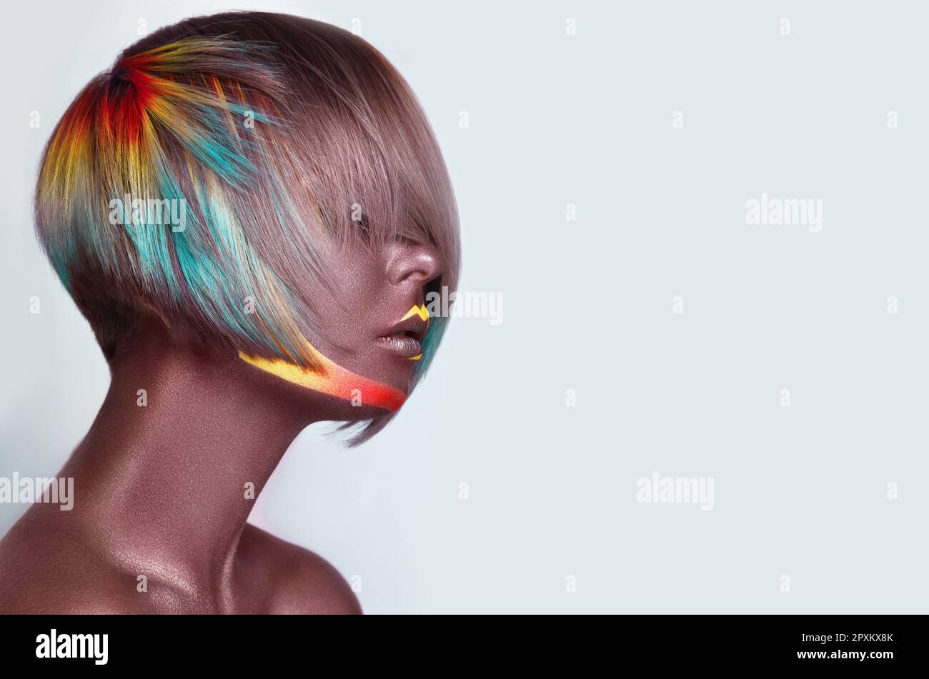 Beautiful girl with multi-colored hair and creative make up and ...