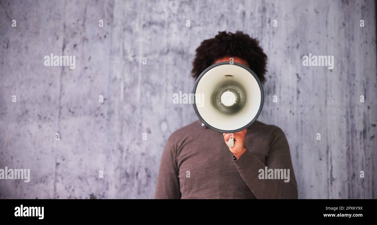 Man Making Announcement Using Megaphone Against Gray Background Stock ...