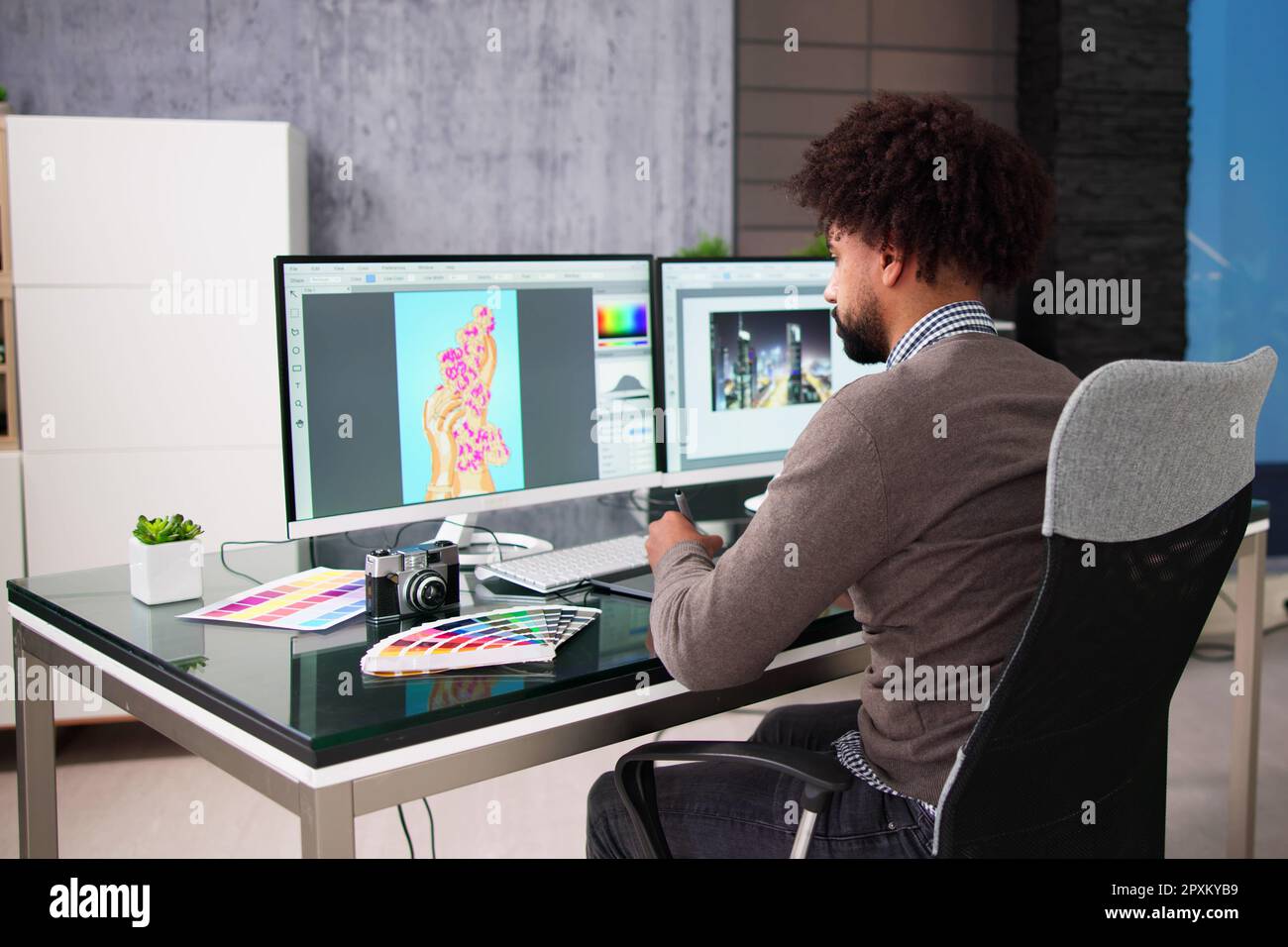 African Graphic Web Designer Using Design Editing Software Stock Photo ...