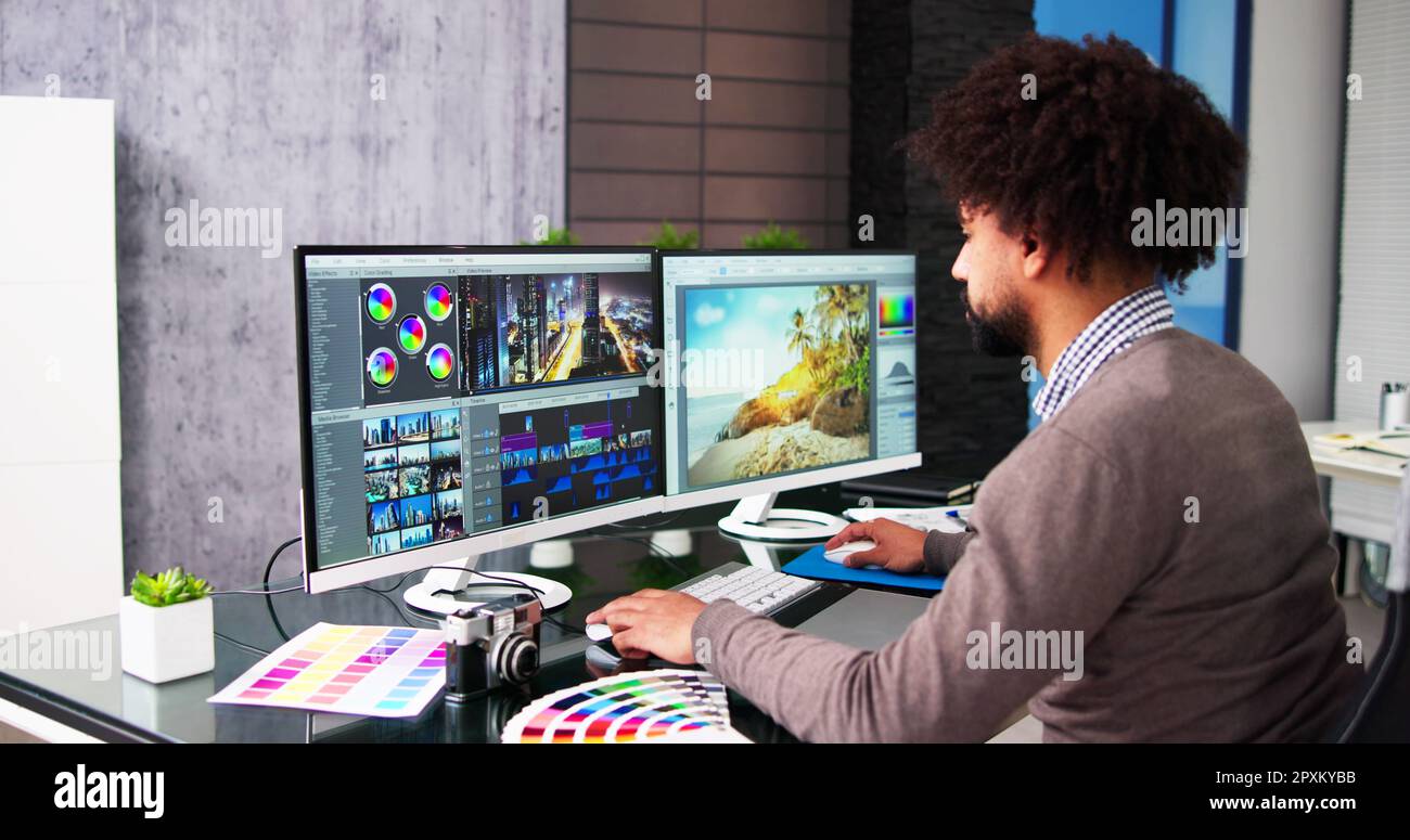 African American Video Editor Tech Job Using Computer Stock Photo - Alamy