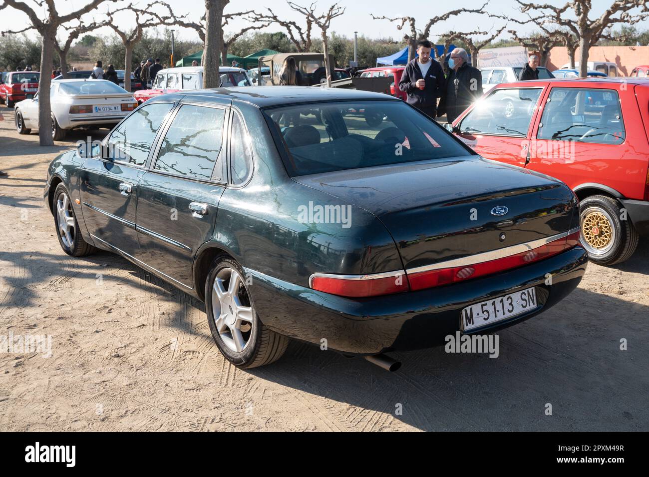 Detail of a typical American car from the 90s, it is a dark green Ford ...