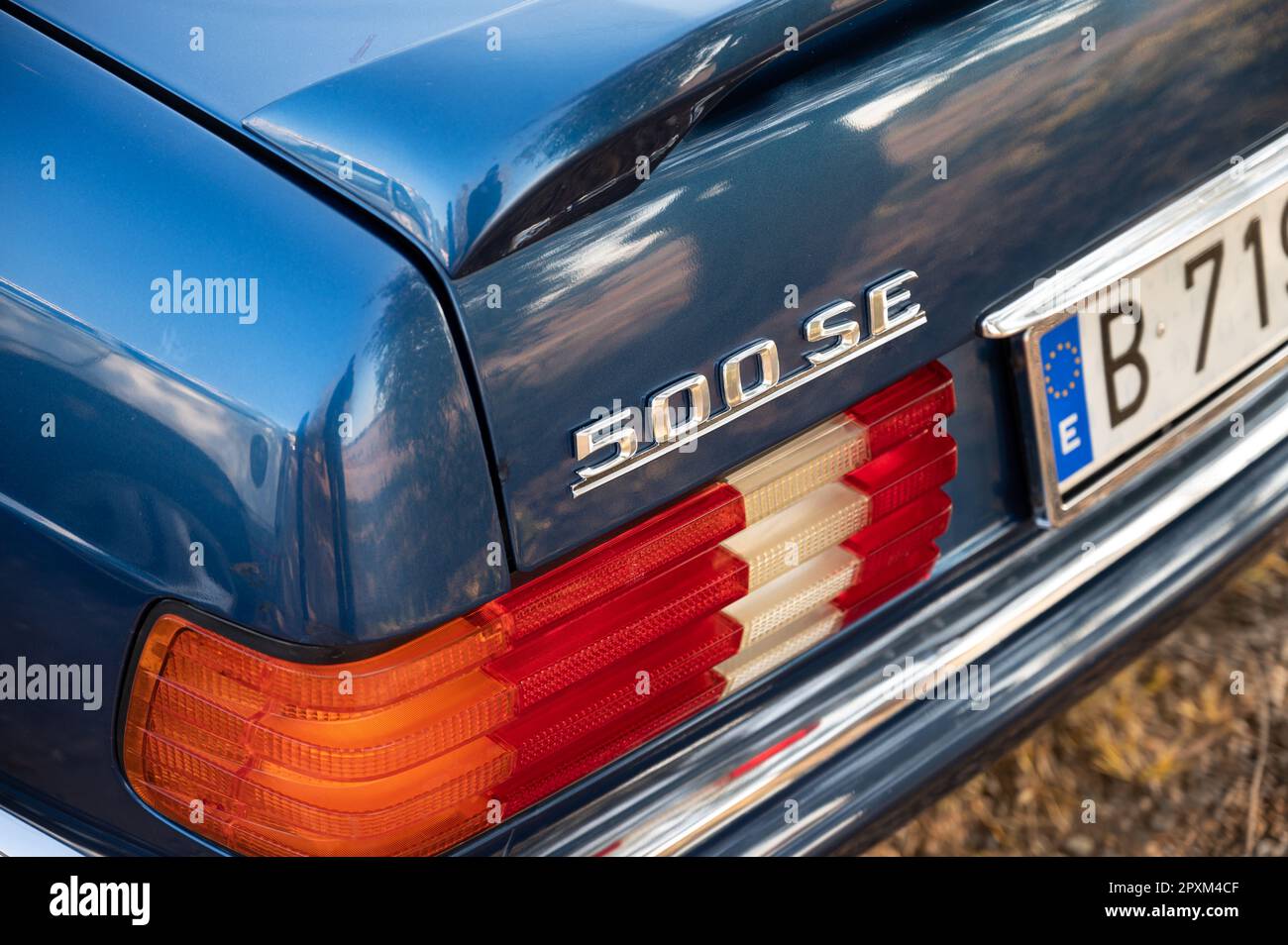 Detail of the name and emblem of a beautiful classic Mercedes Benz W126 ...
