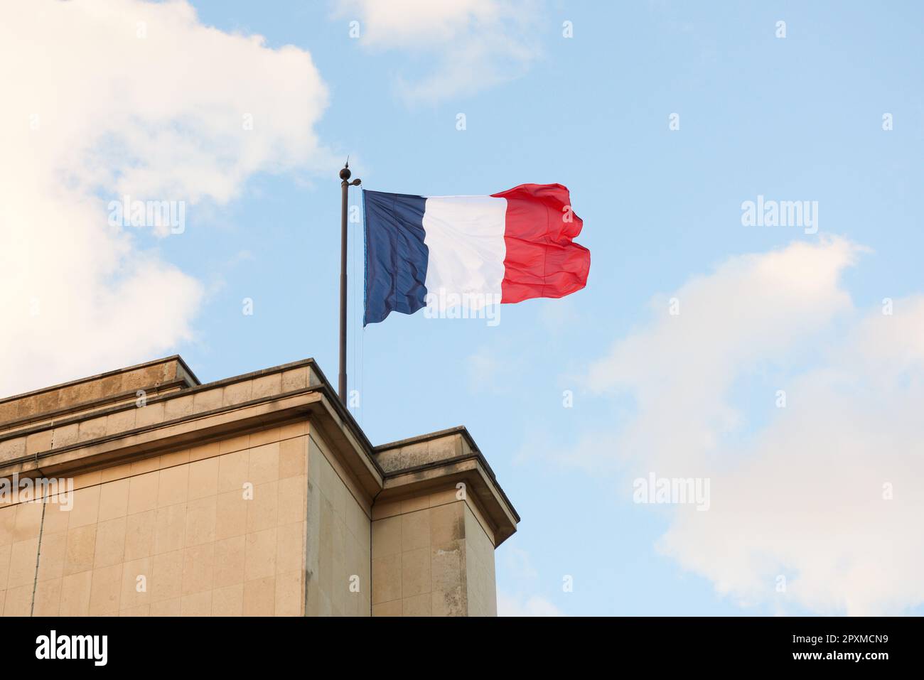 a French flag flies in the wind at sunset Stock Photo - Alamy