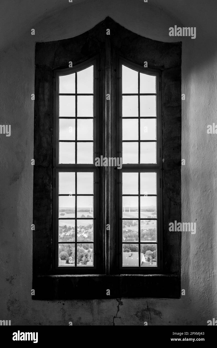 Ancient wooden window of a medieval castle. Background. Black and white ...