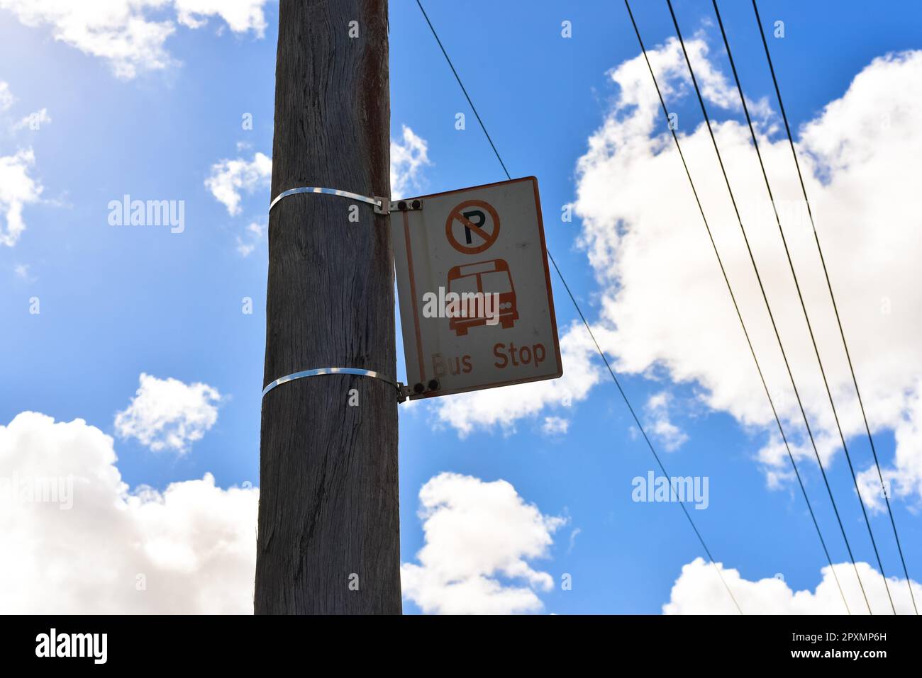 A traffic control sign is affixed to a pole in a public area ...