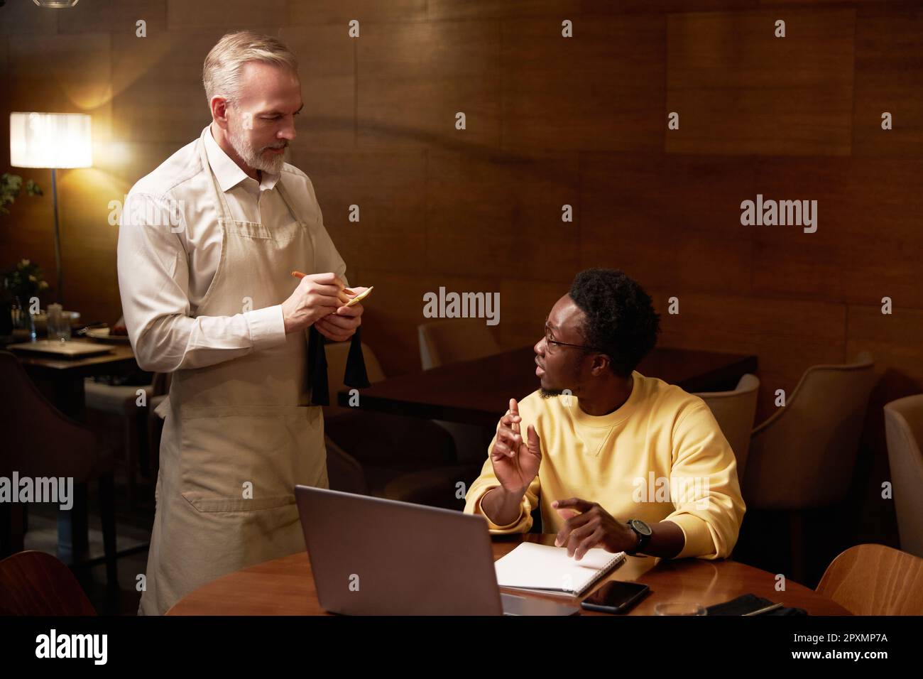 Waiter taking order from man hi-res stock photography and images - Alamy