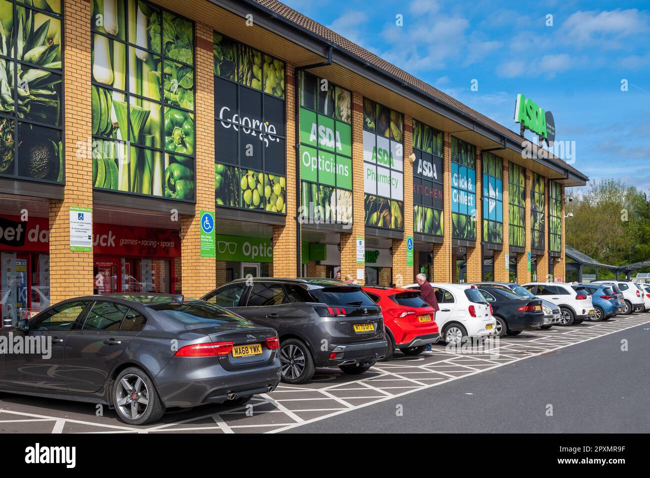Asda superstore in the sunshine at Westbrook in Warrington with row of ...