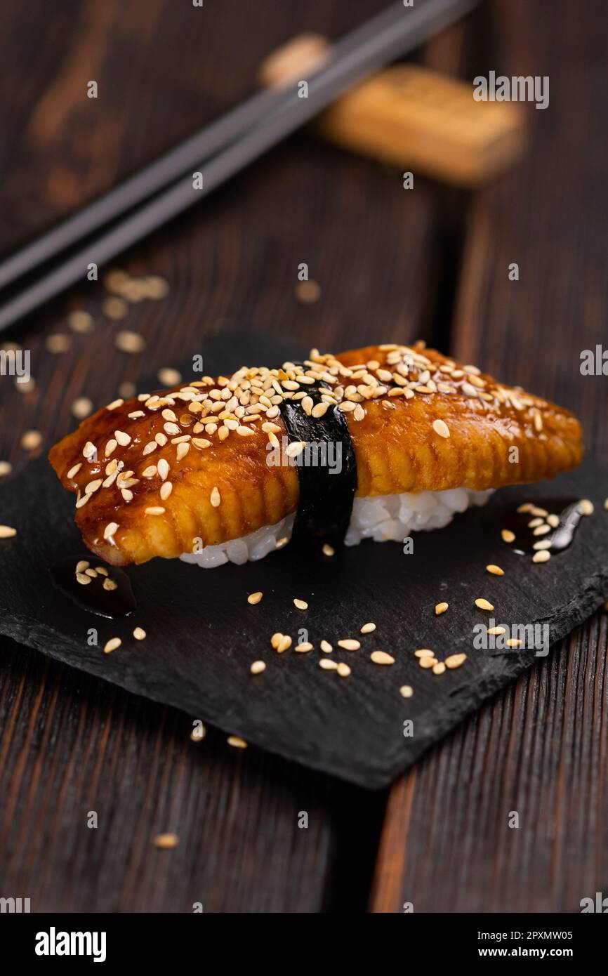 Japanese sushi unagi nigiri sushi eel on wooden background Stock Photo - Alamy