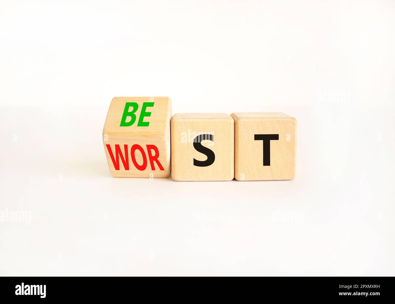 Best or worst symbol. Businessman turns wooden cubes and changes the ...