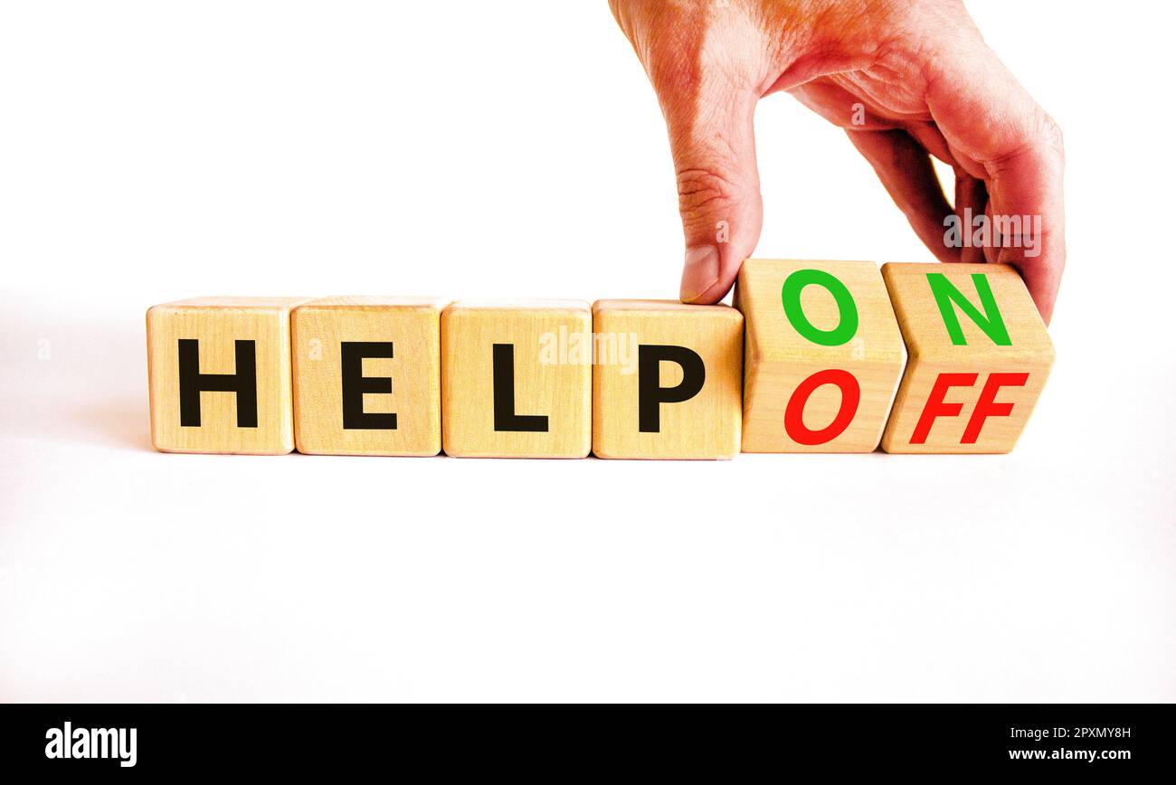 Help on or off symbol. Businessman turns wooden cubes and changes word ...