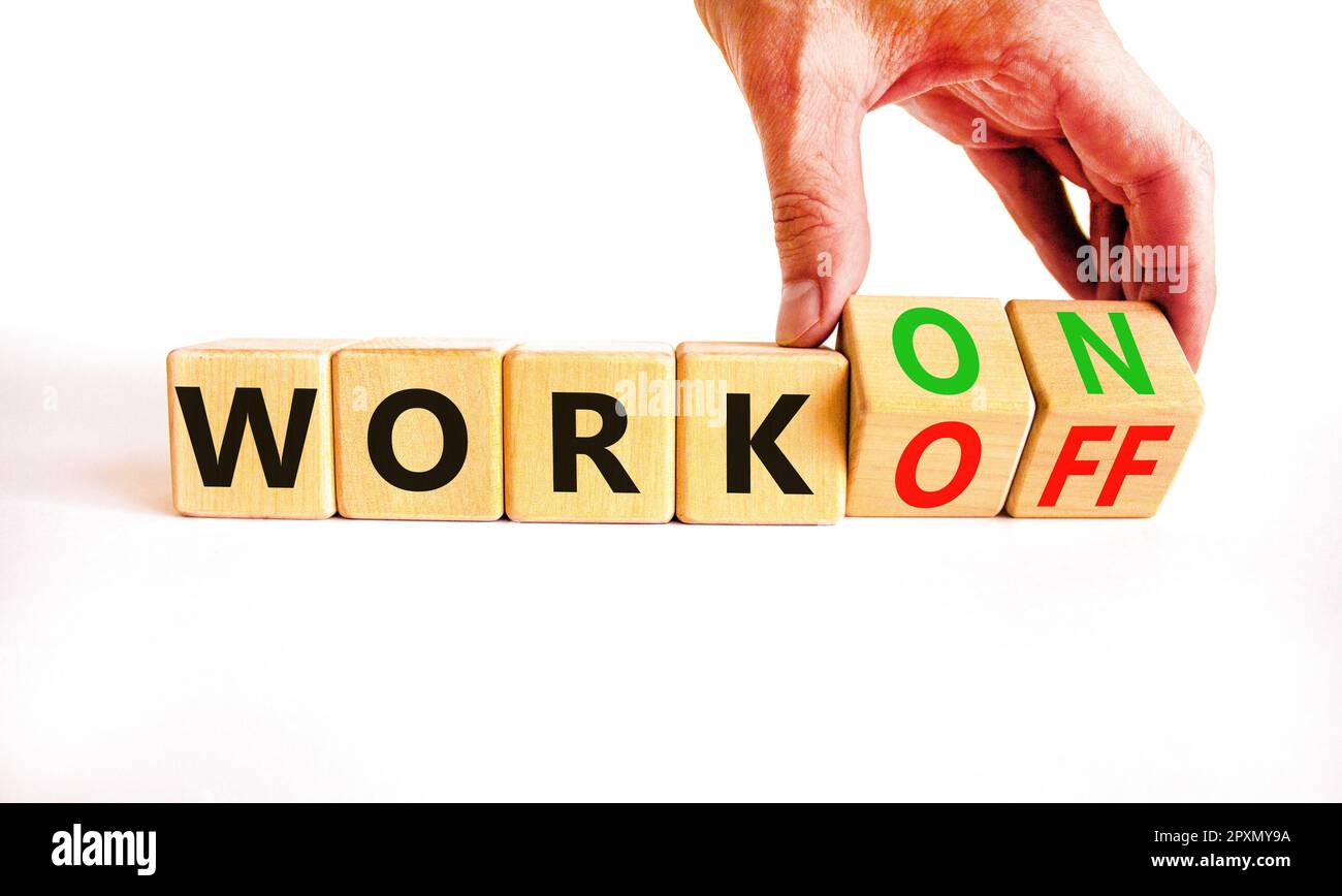 Work on or off symbol. Businessman turns wooden cubes and changes word ...