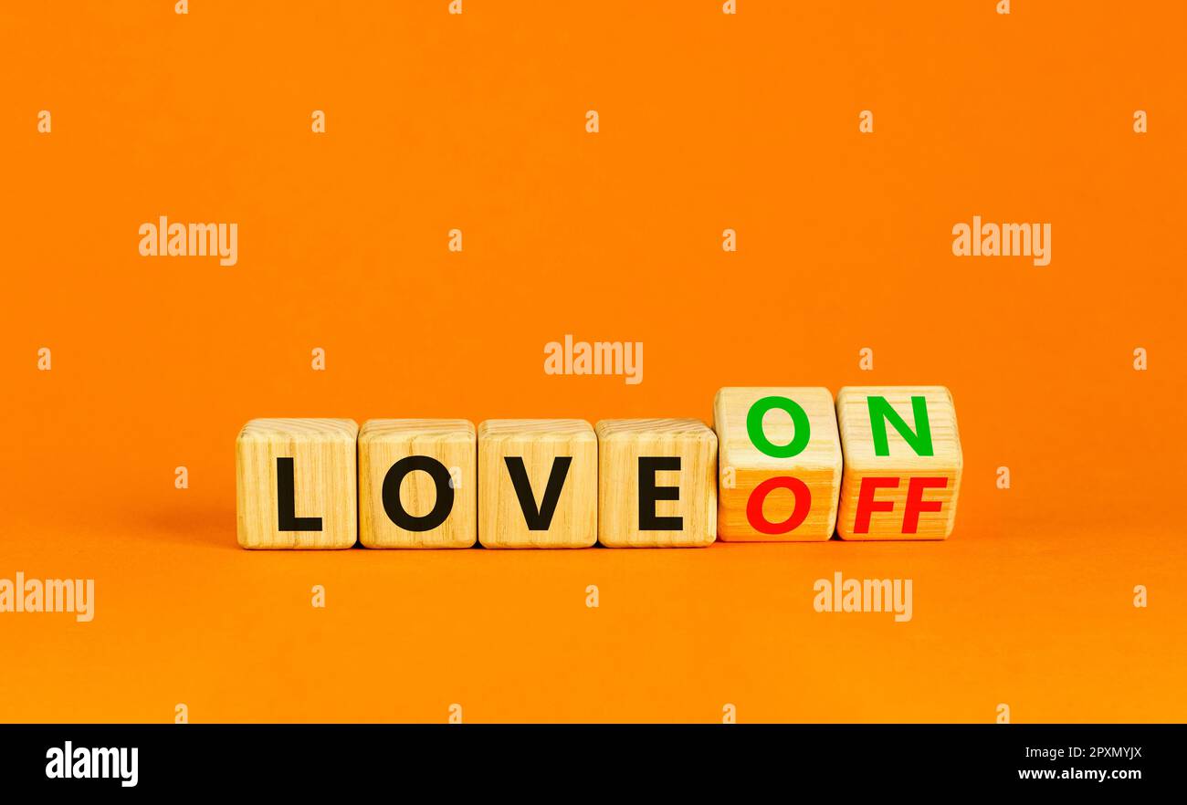 Love on or off symbol. Businessman turns wooden cubes and changes word ...