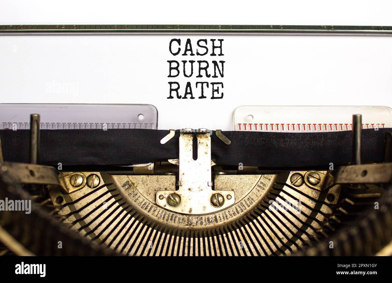 Cash burn rate symbol. Concept words Cash burn rate typed on an old ...