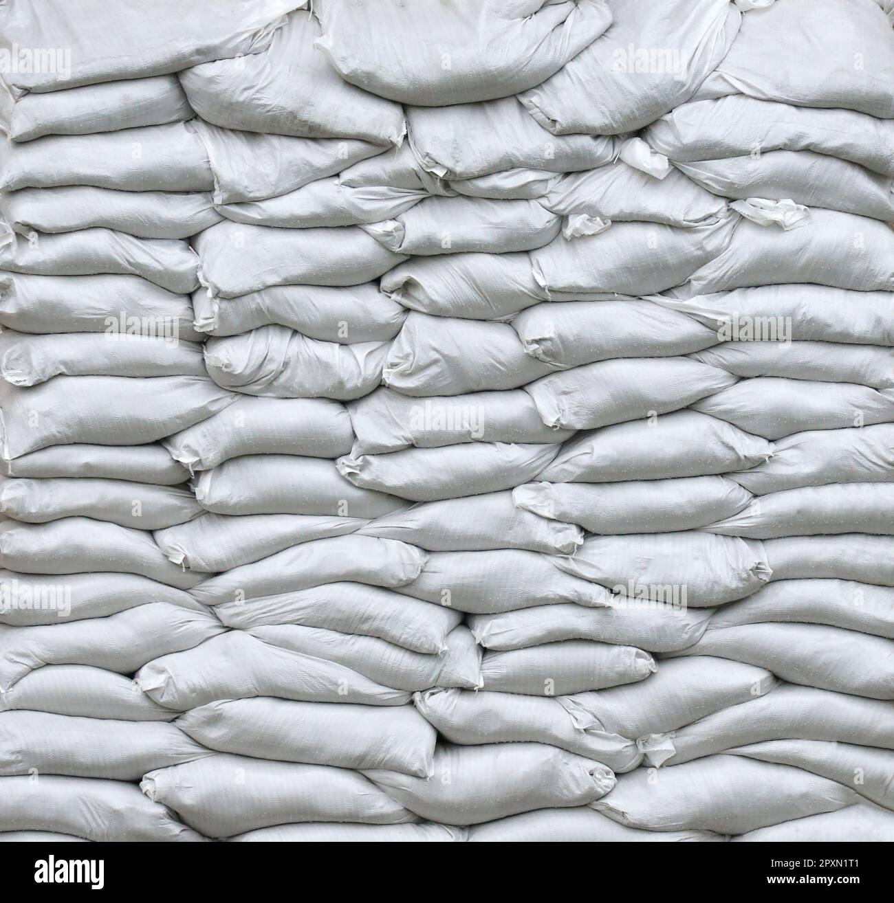 Texture of barricade wall made of white sandbags for war purposes ...