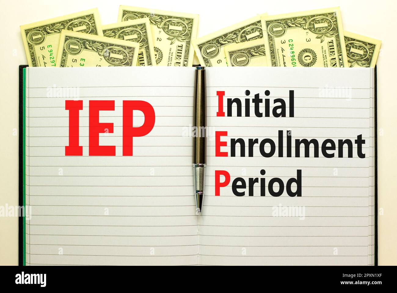 IEP symbol. Concept words IEP Initial enrollment period on beautiful white note. Dollar bills ...