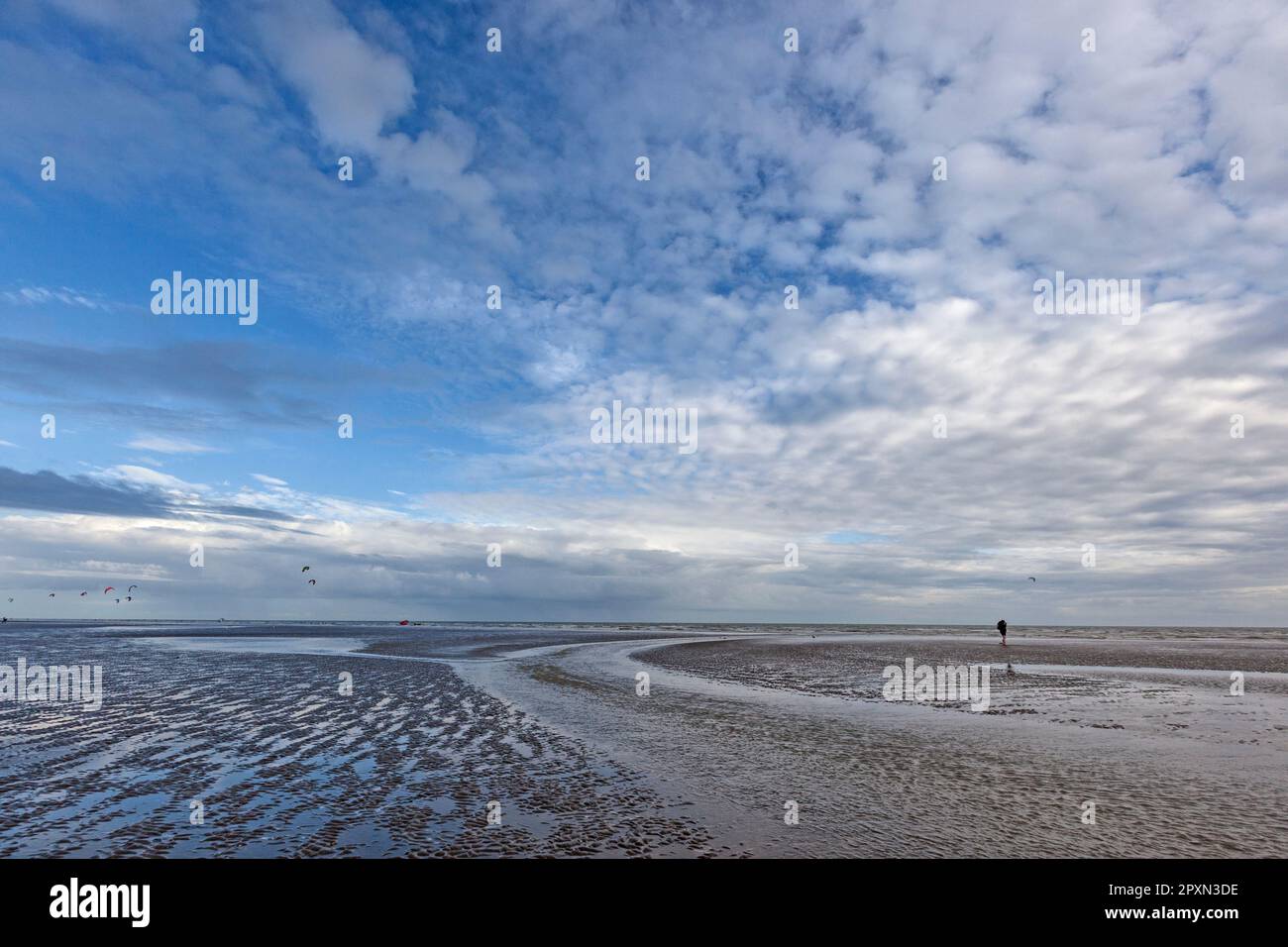Single person on lonely sunny windy Camber Sands at Rye Bay by English ...