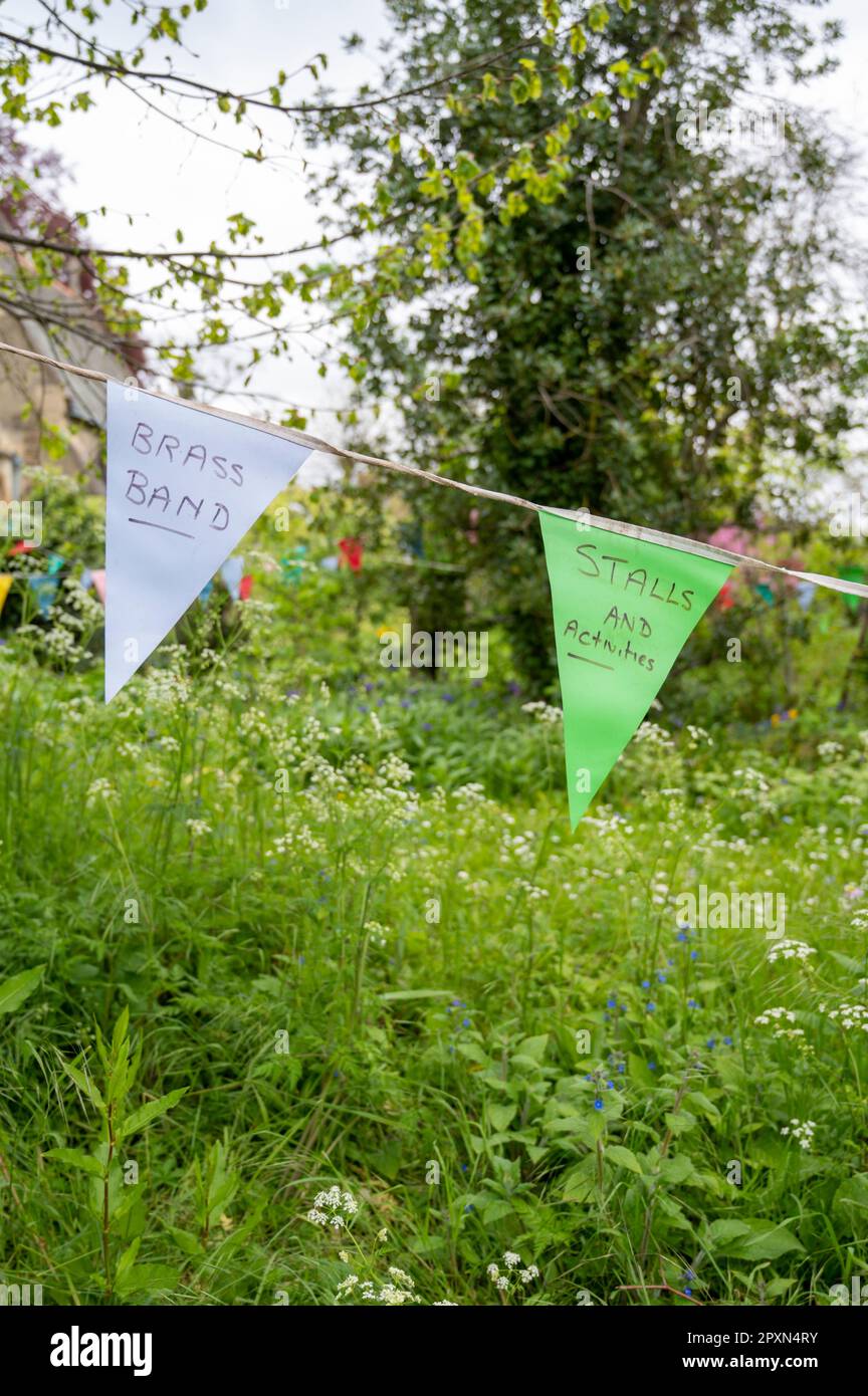 A bunting for a garden fete with brass band, stalls and activities ...