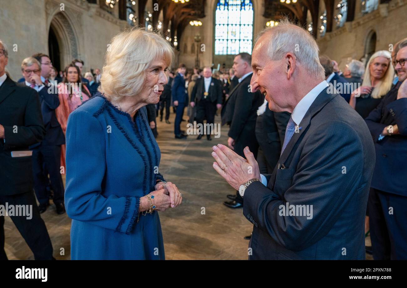 The Queen Consort speaks with Baron Peter Ricketts during her visit to ...