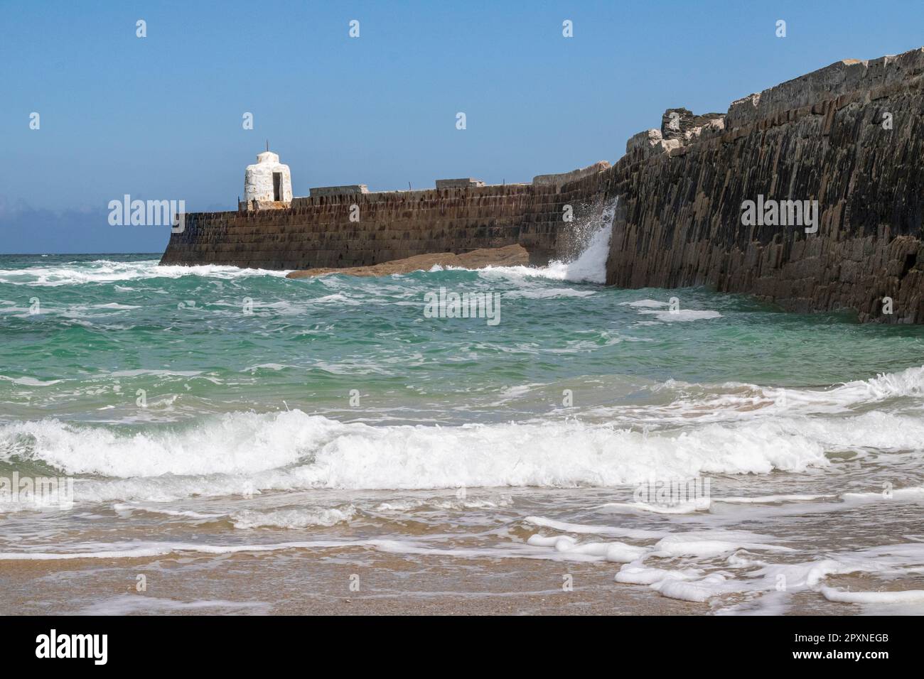 Sea View of Waves Breaking Against the Harbour Wall with Look Out Hut ...