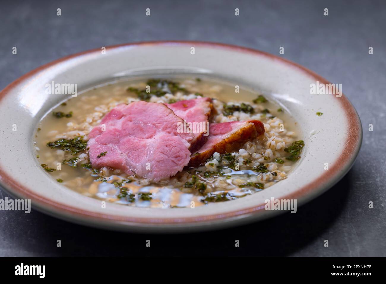 broth with smoked meat and groats Stock Photo - Alamy